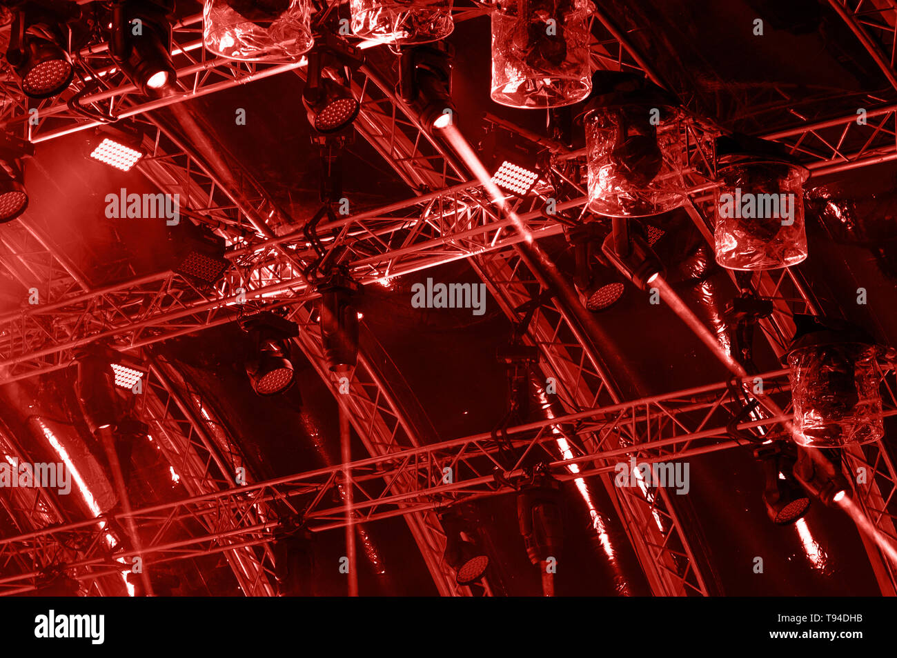 Colorful concert lighting. Red color concert lighting on a dark ...