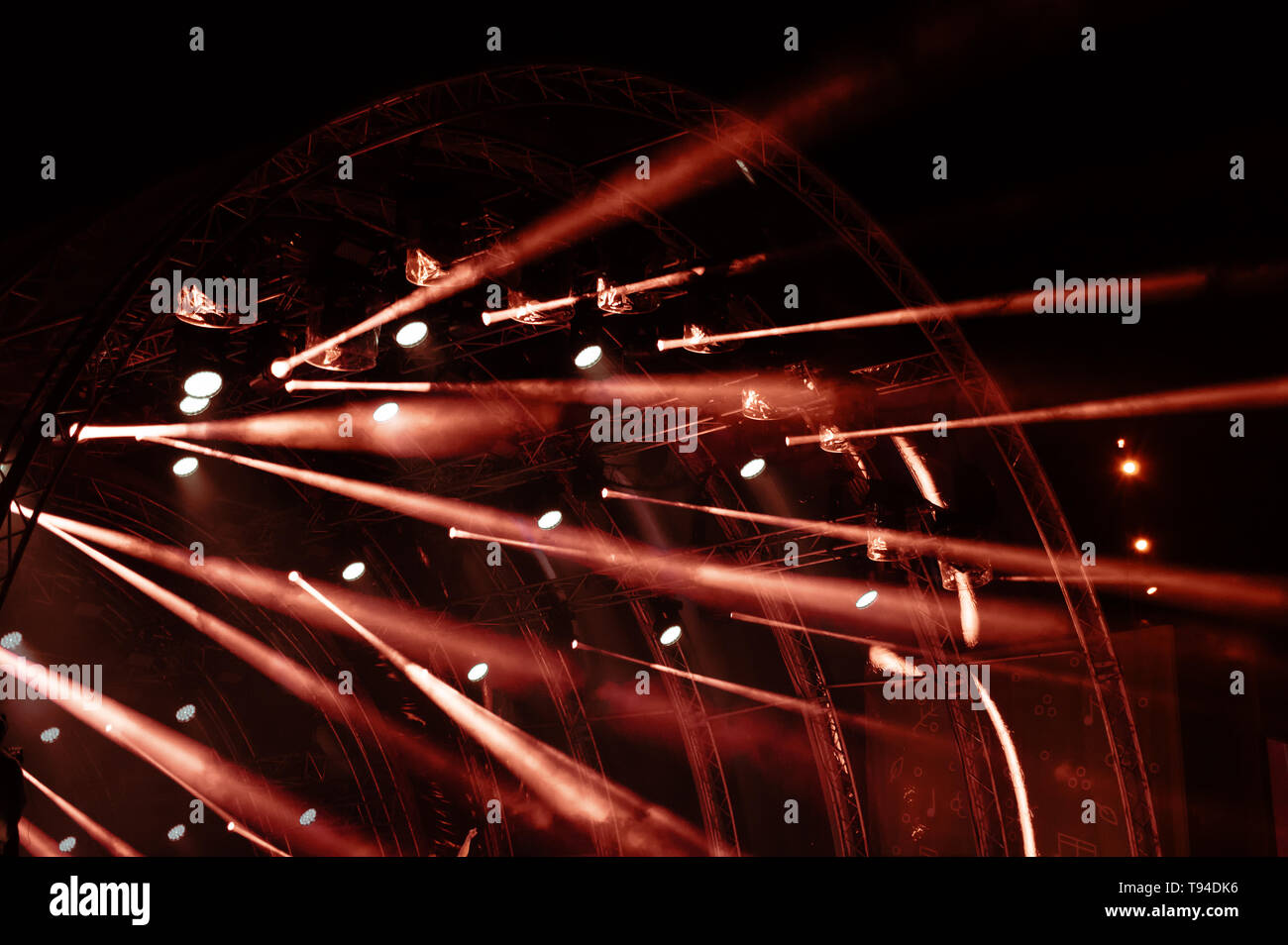 Colorful concert lighting. Red color concert lighting on a dark ...