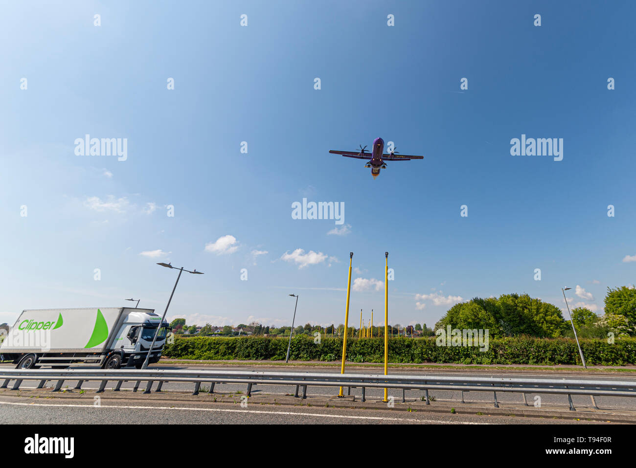 FlyBe ATR 72 airliner plane on final approach to land crossing over ...