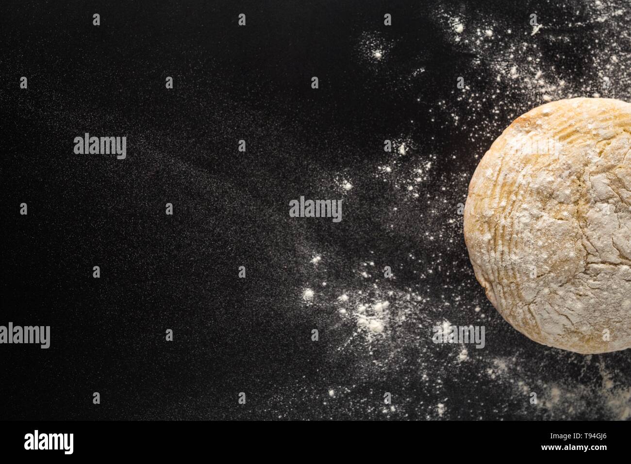 Freshly baked bread with spilled flour Stock Photo - Alamy