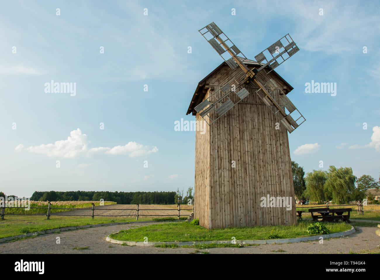 Historic old wooden windmill and blue sky - Polish country Stock Photo ...