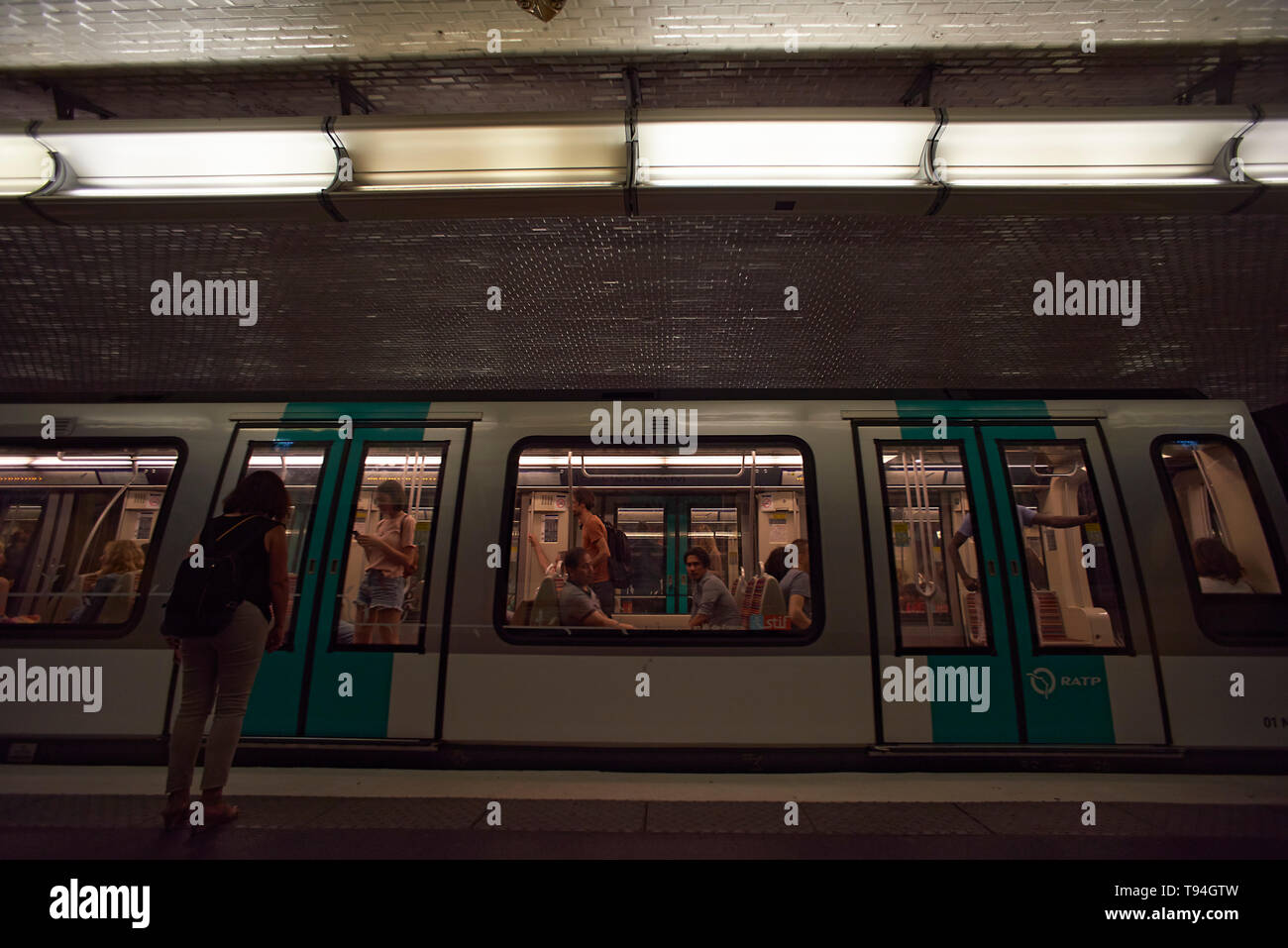 An old rundown metro train at the platform in the city centre of Paris ...