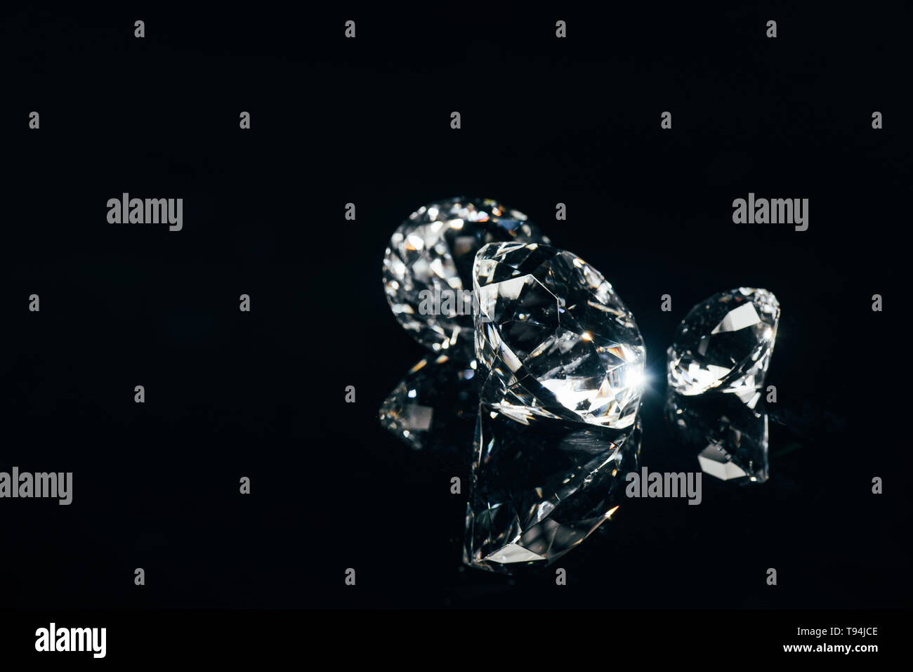 transparent pure diamonds isolated on black with reflection Stock Photo ...