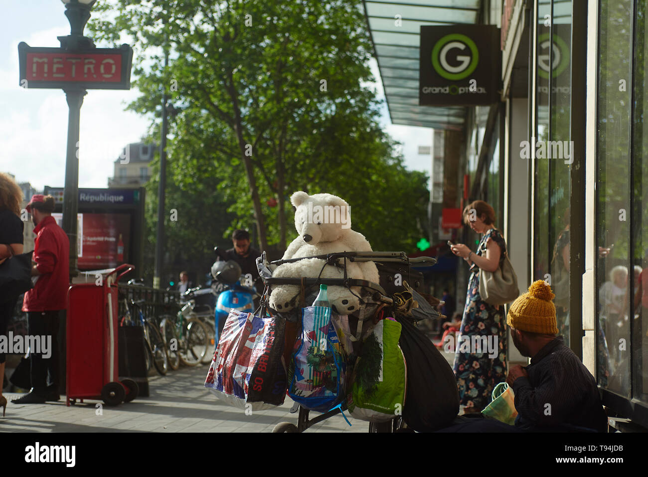 A homeless man sitting outside a shop near the metro station in the ...