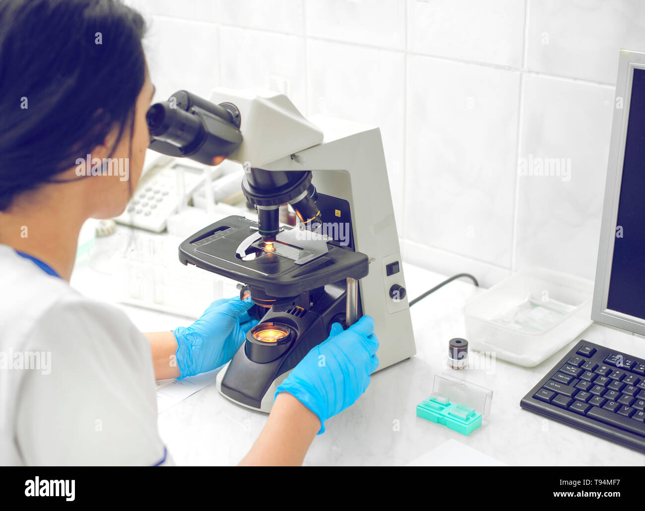 image of scientist using microscope in laboratory Stock Photo - Alamy