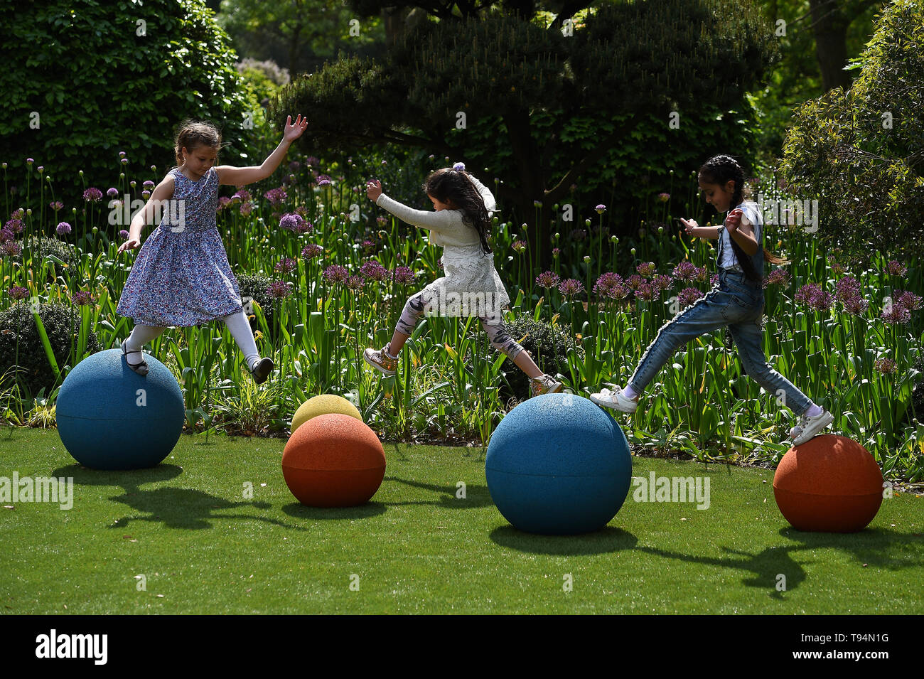 Children jump between balls in the new Children's Garden at Kew Gardens ...