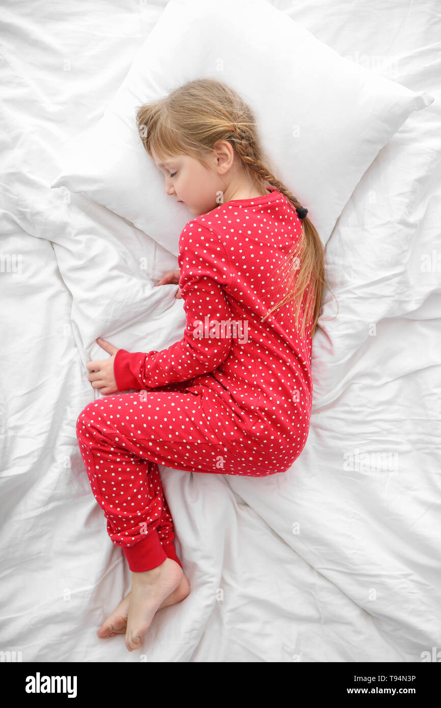 Cute little girl sleeping in bed, top view Stock Photo - Alamy