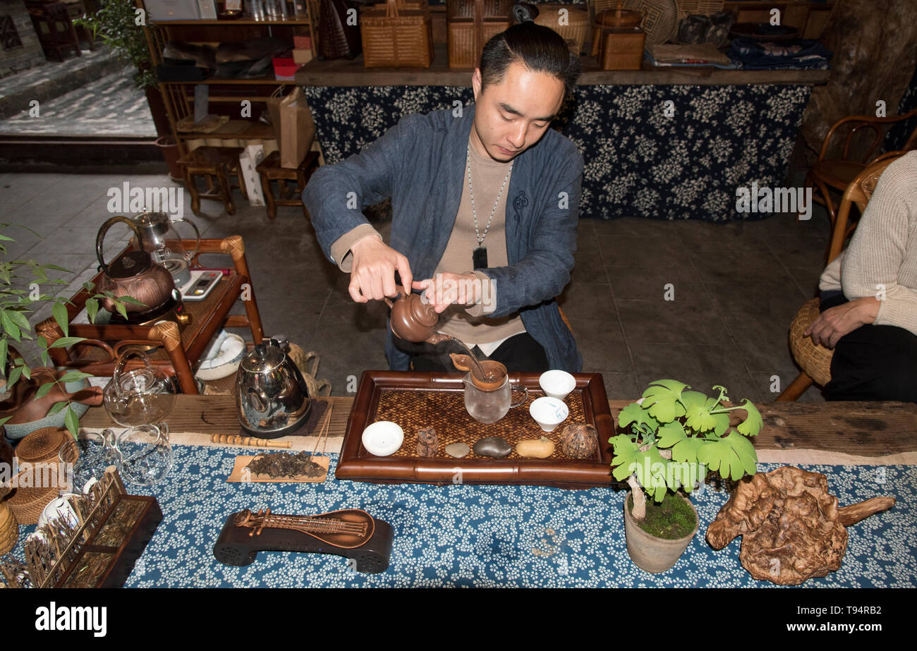 Chinese Tea Ceremony. Male server prepares the traditional tea ...