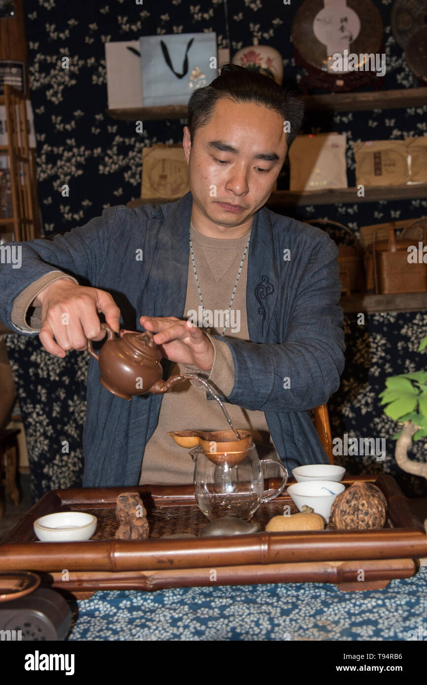Chinese Tea Ceremony. Male server prepares the traditional tea ...