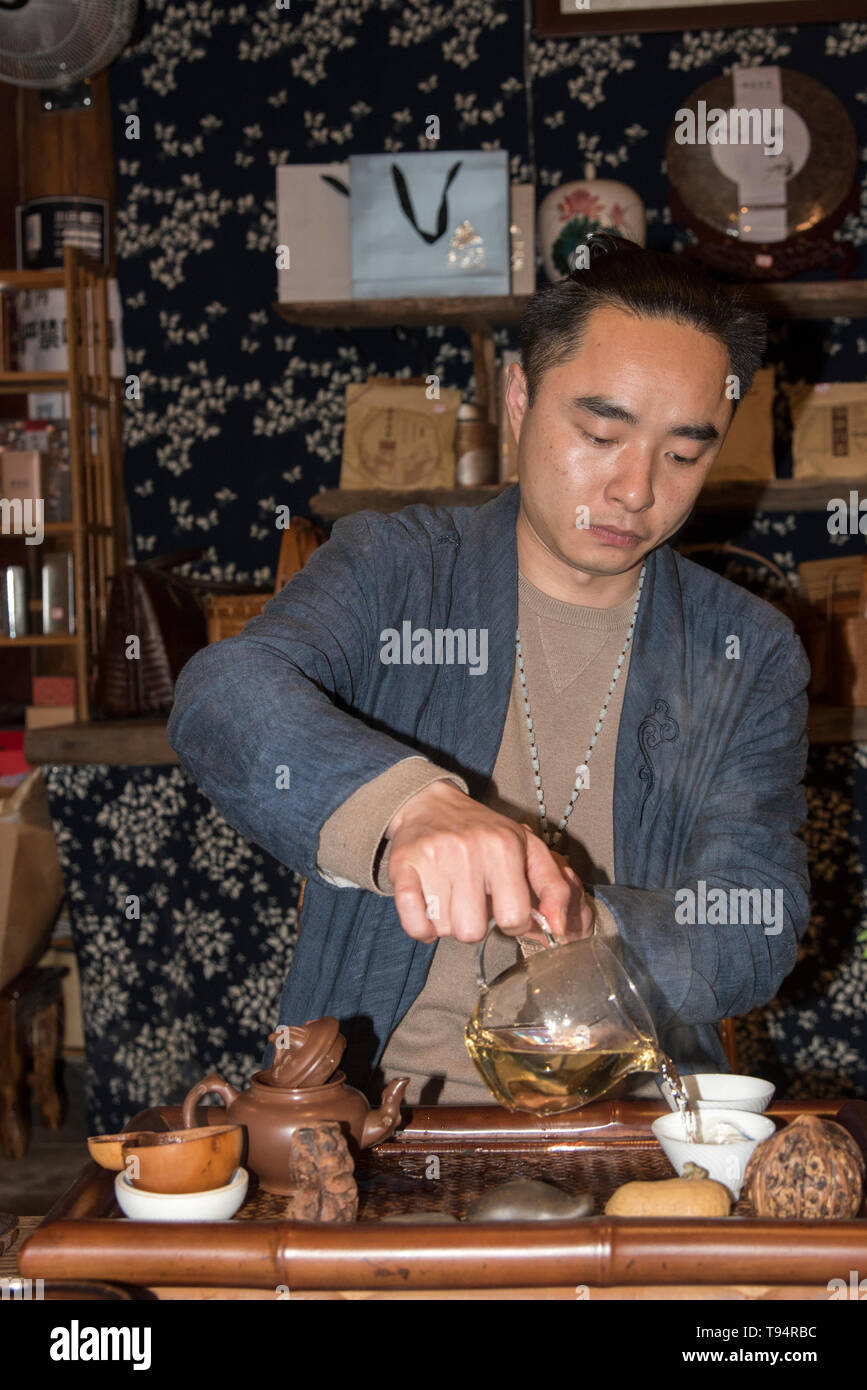 Chinese Tea Ceremony. Male server prepares the traditional tea ...