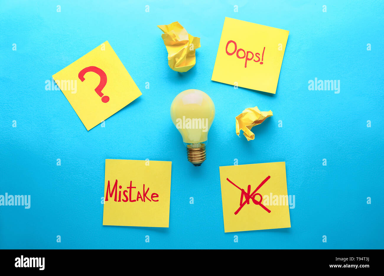 Light bulb and paper stickers on color background. Learning from ...