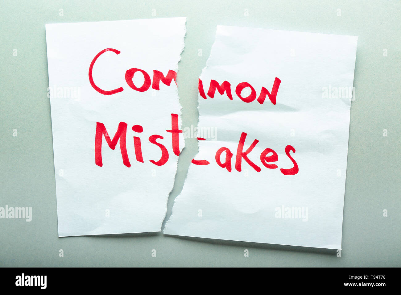 Torn sheet of paper with text COMMON MISTAKES on light background Stock ...