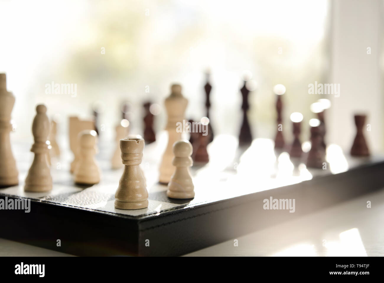 Game board with chess pieces on windowsill Stock Photo - Alamy