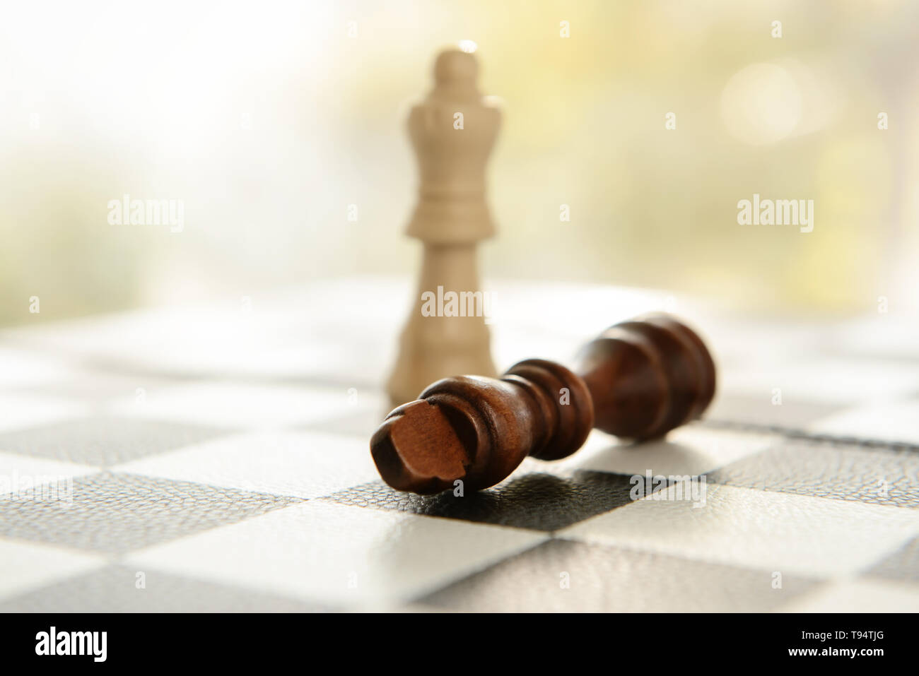 Game board with chess pieces on blurred background Stock Photo - Alamy