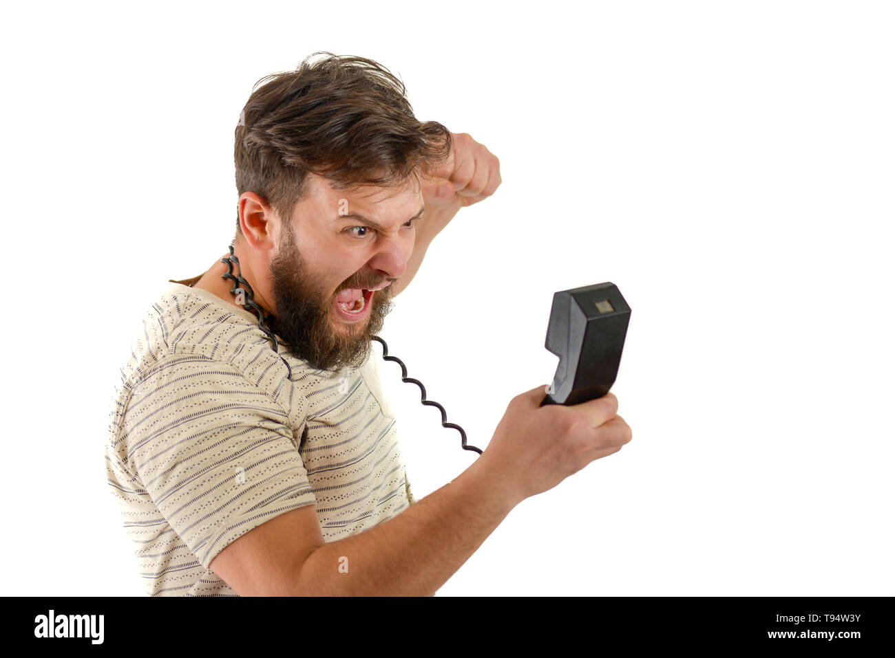 Photo of an angry man who is speaking at an old phone, isolated on ...