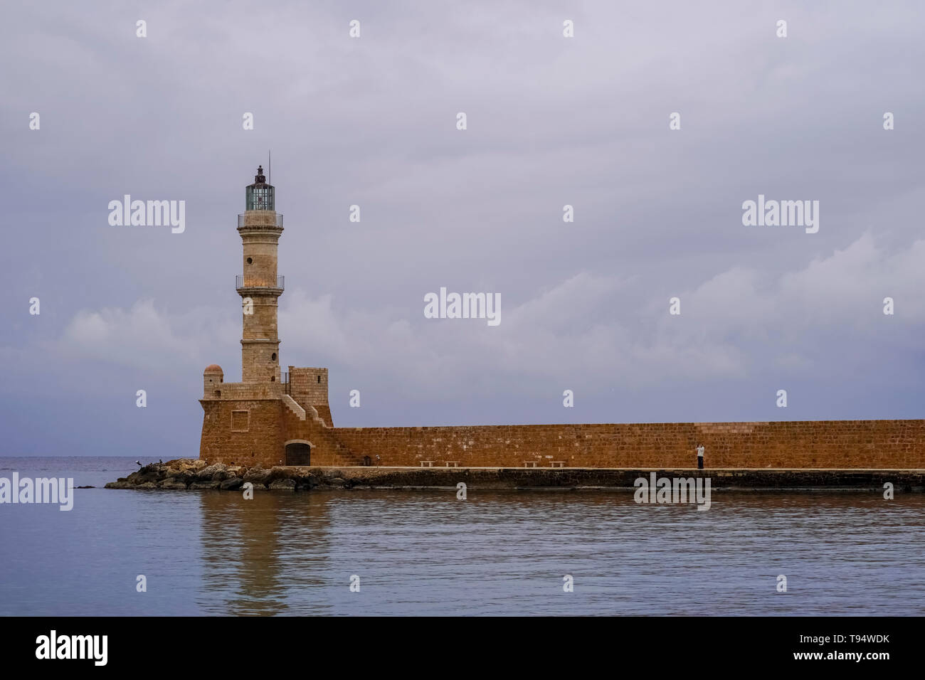 Lighthouse in the old, Venetian harbour at Chania, Crete, Greece Stock ...
