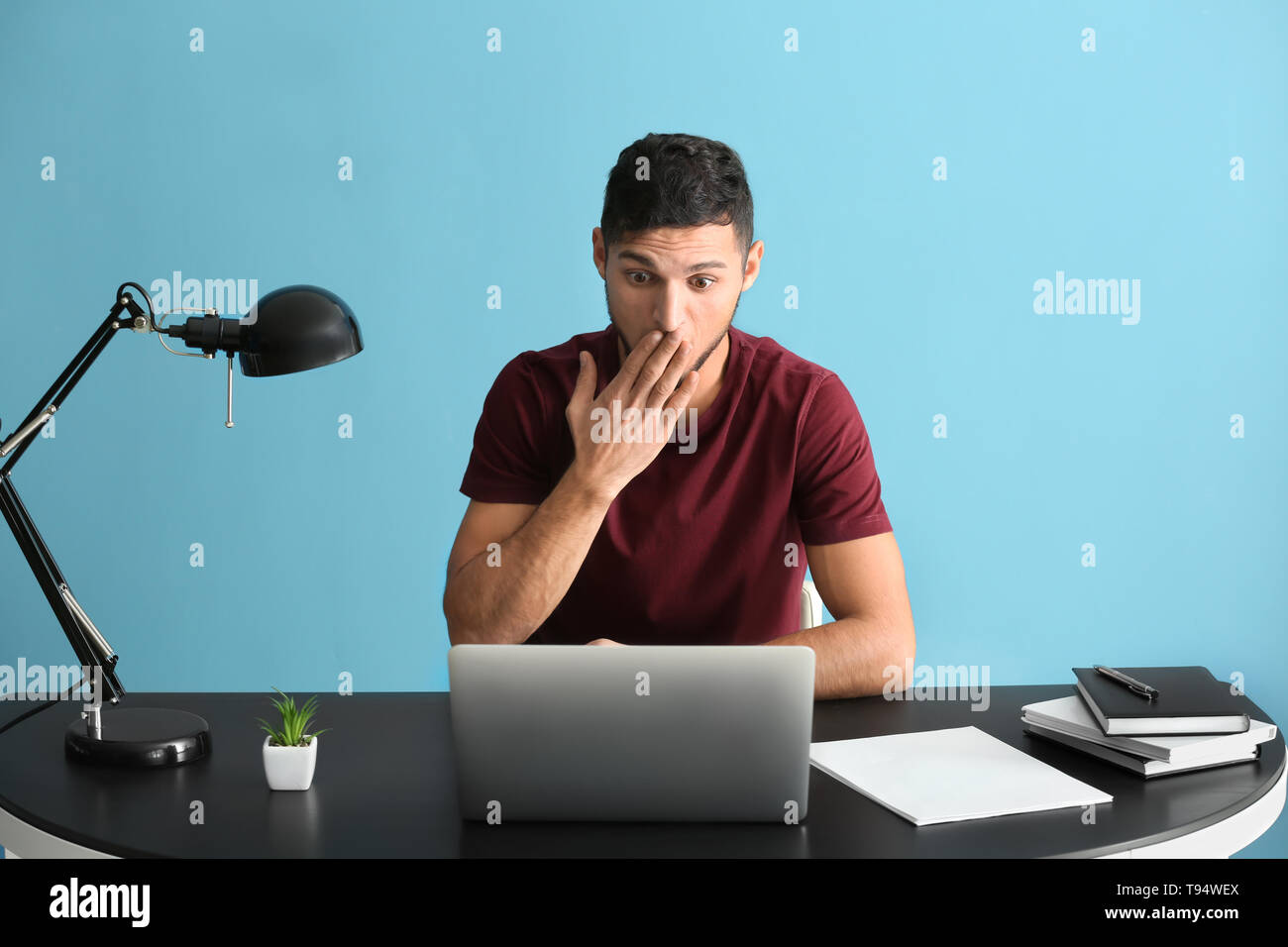 Emotional young man after making mistake during work with laptop Stock ...