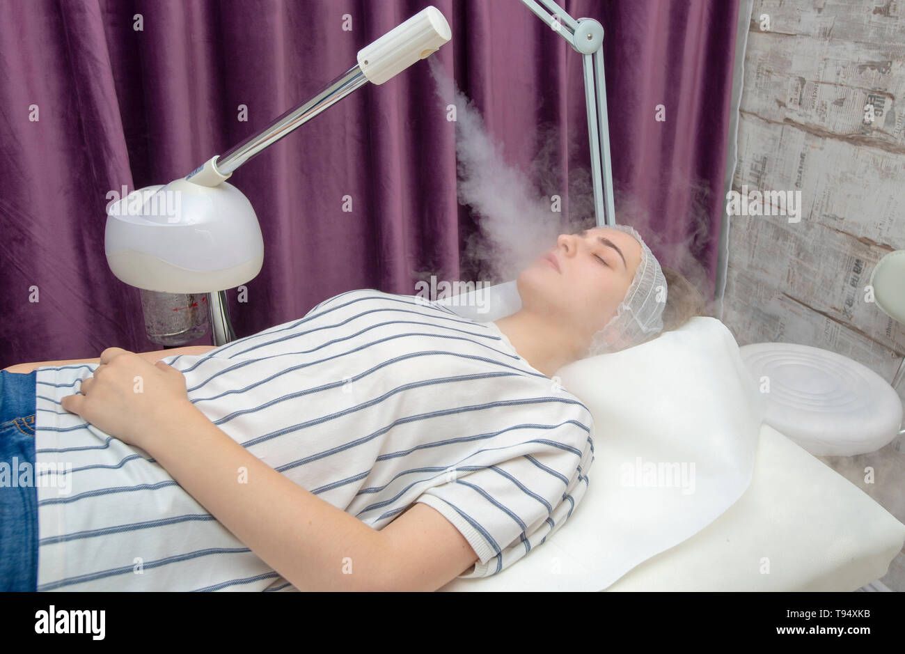 Beauty treatment of young female face, ozone facial steamer Stock Photo ...