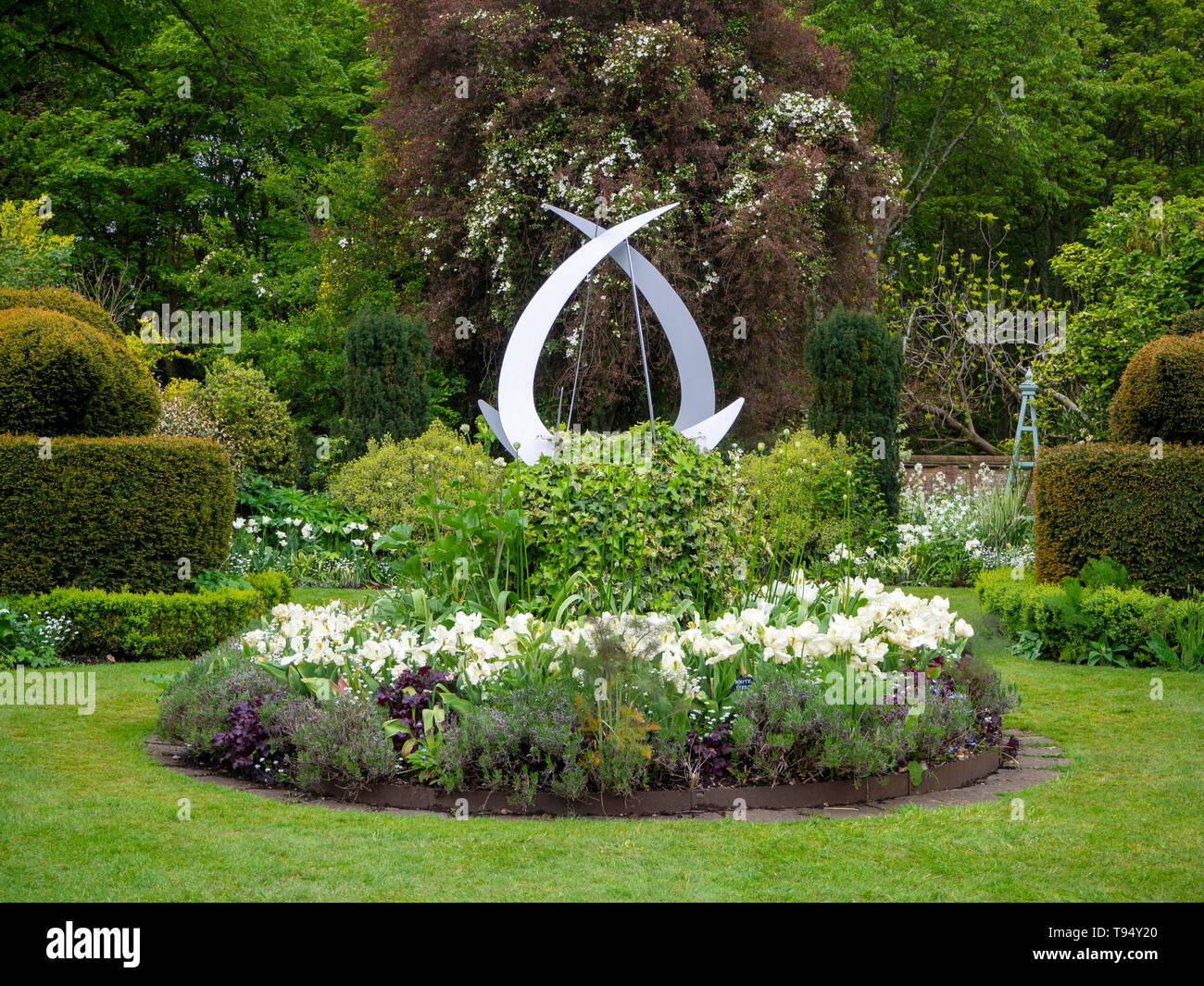 Chenies Manor Topiary Garden in Spring with tulips White Parrot ...