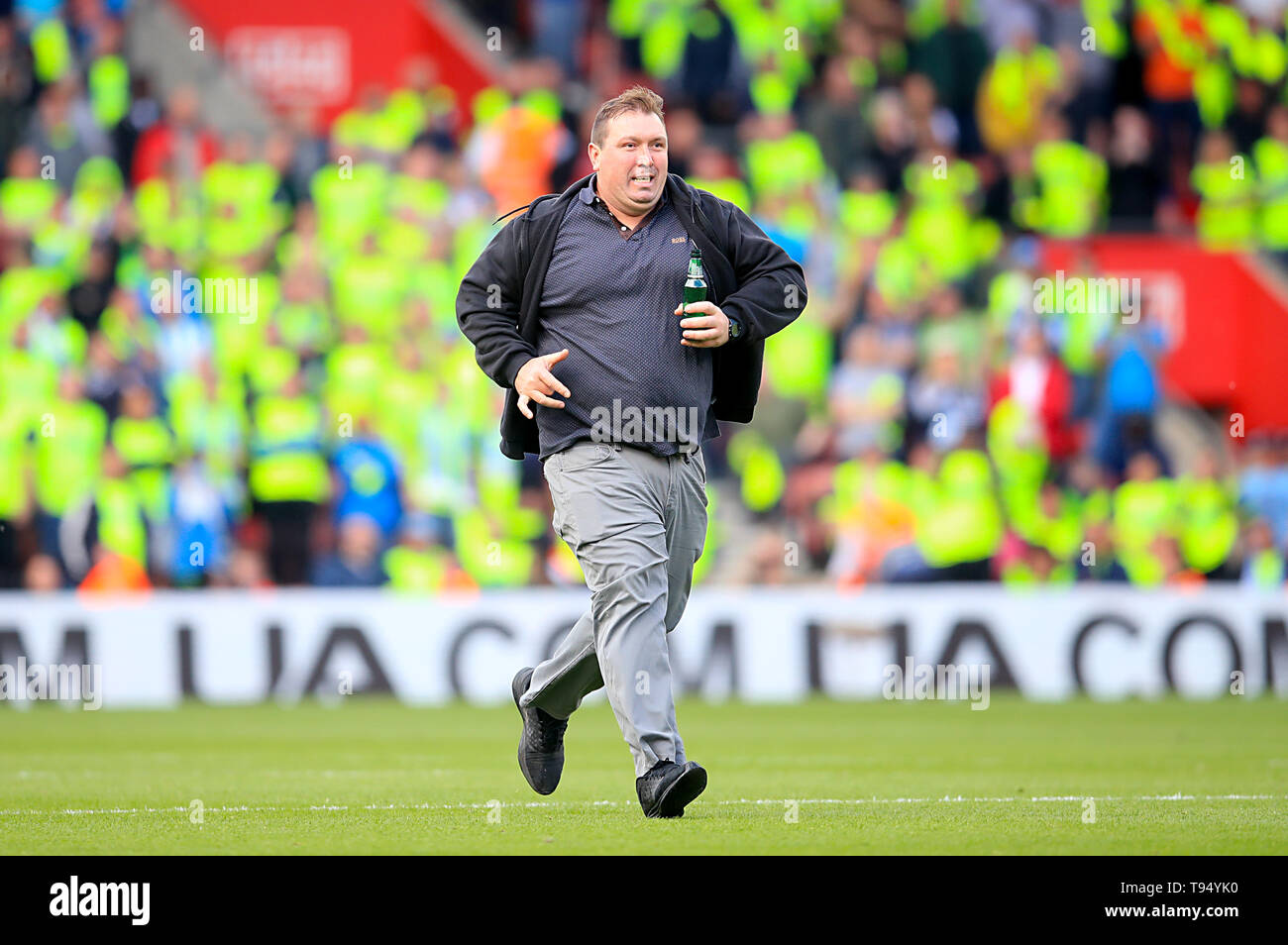 A pitch invader runs onto the pitch hi-res stock photography and images ...