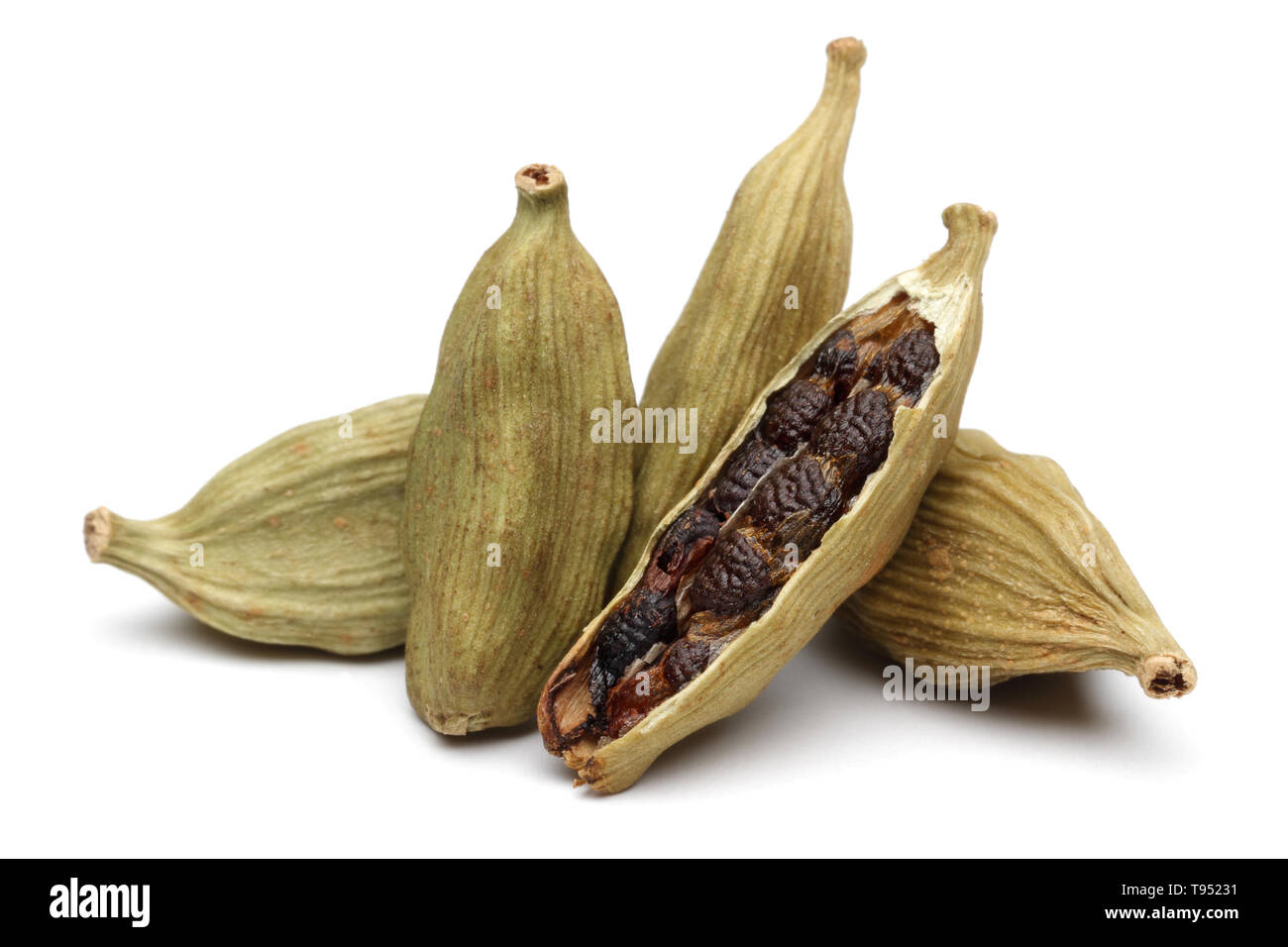 Cardamom pods and seeds isolated on white background Stock Photo - Alamy