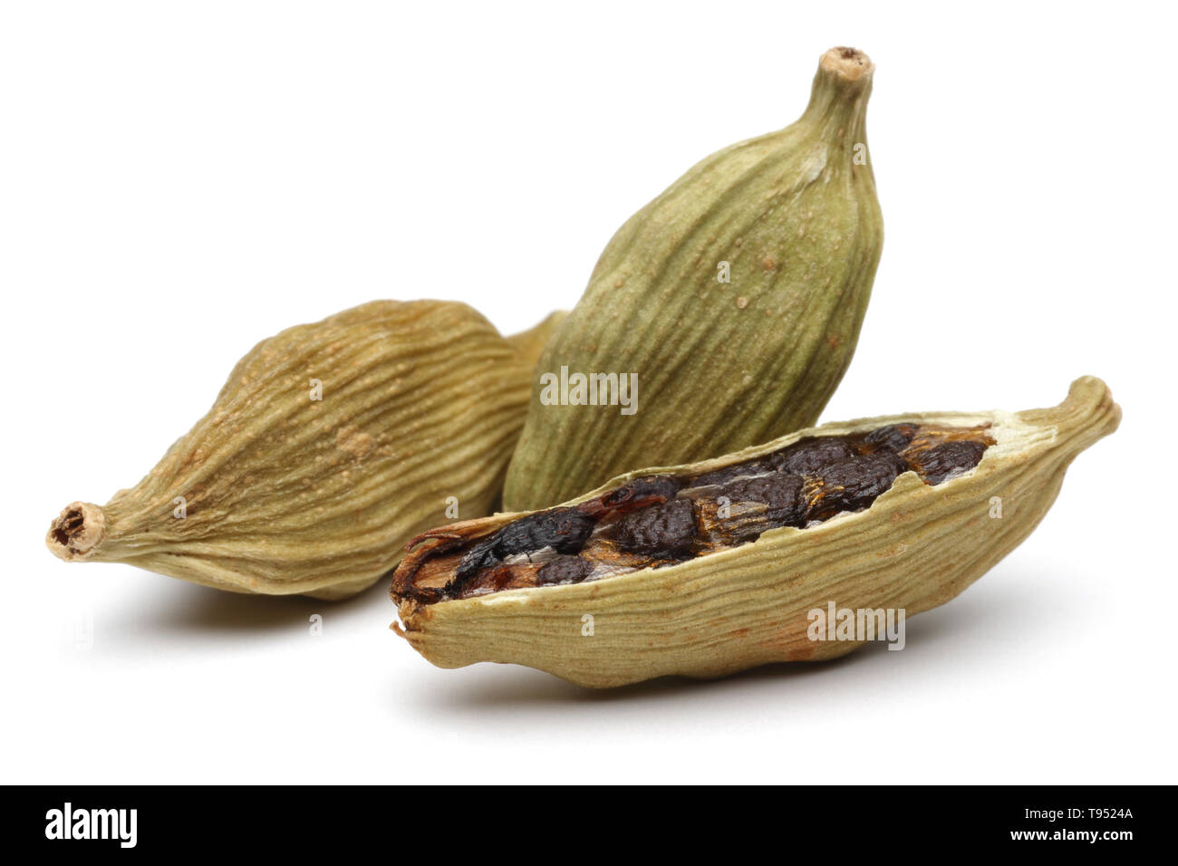 Cardamom pods and seeds isolated on white background Stock Photo - Alamy