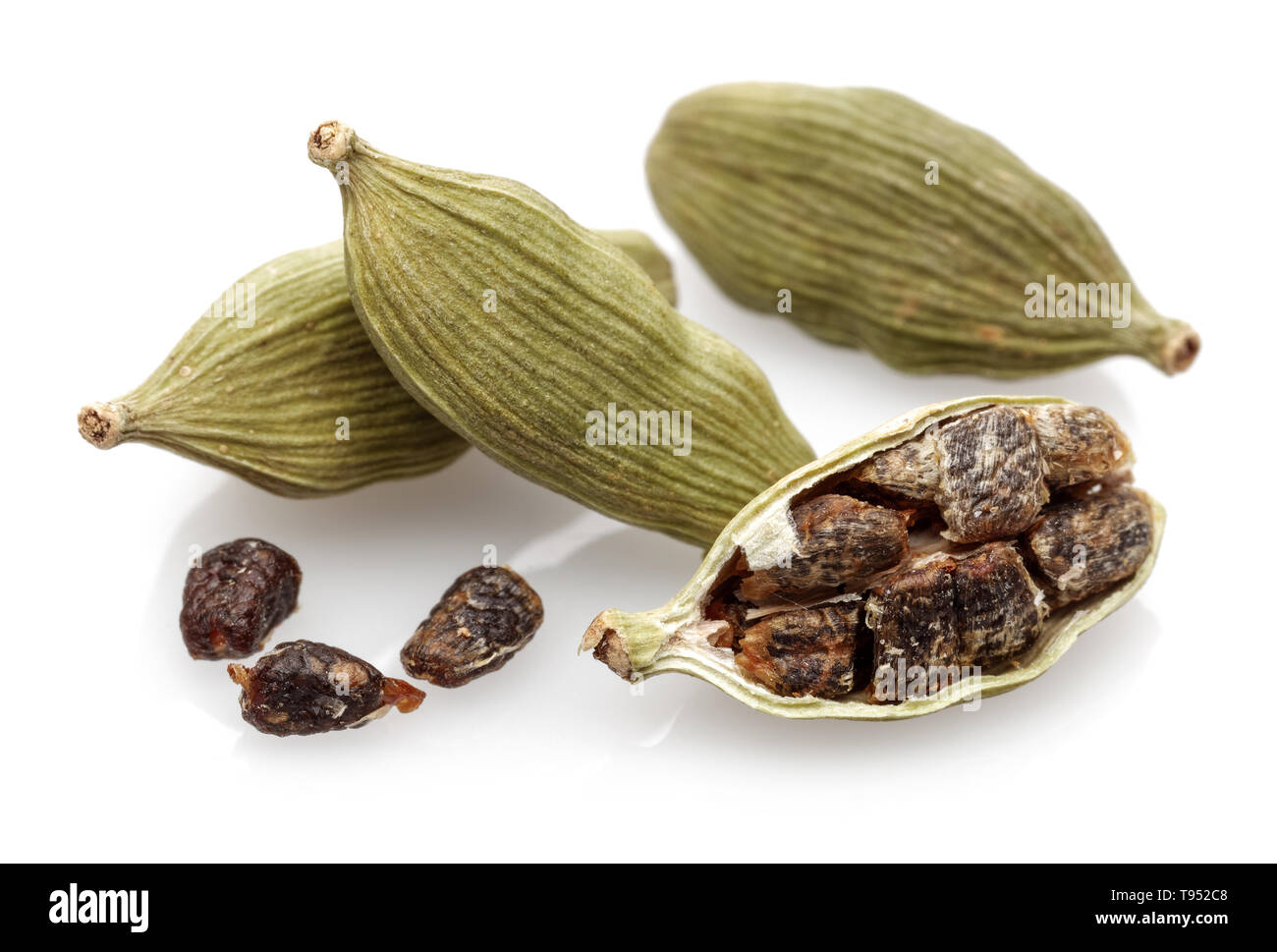 Cardamom pods and seeds isolated on white background Stock Photo - Alamy
