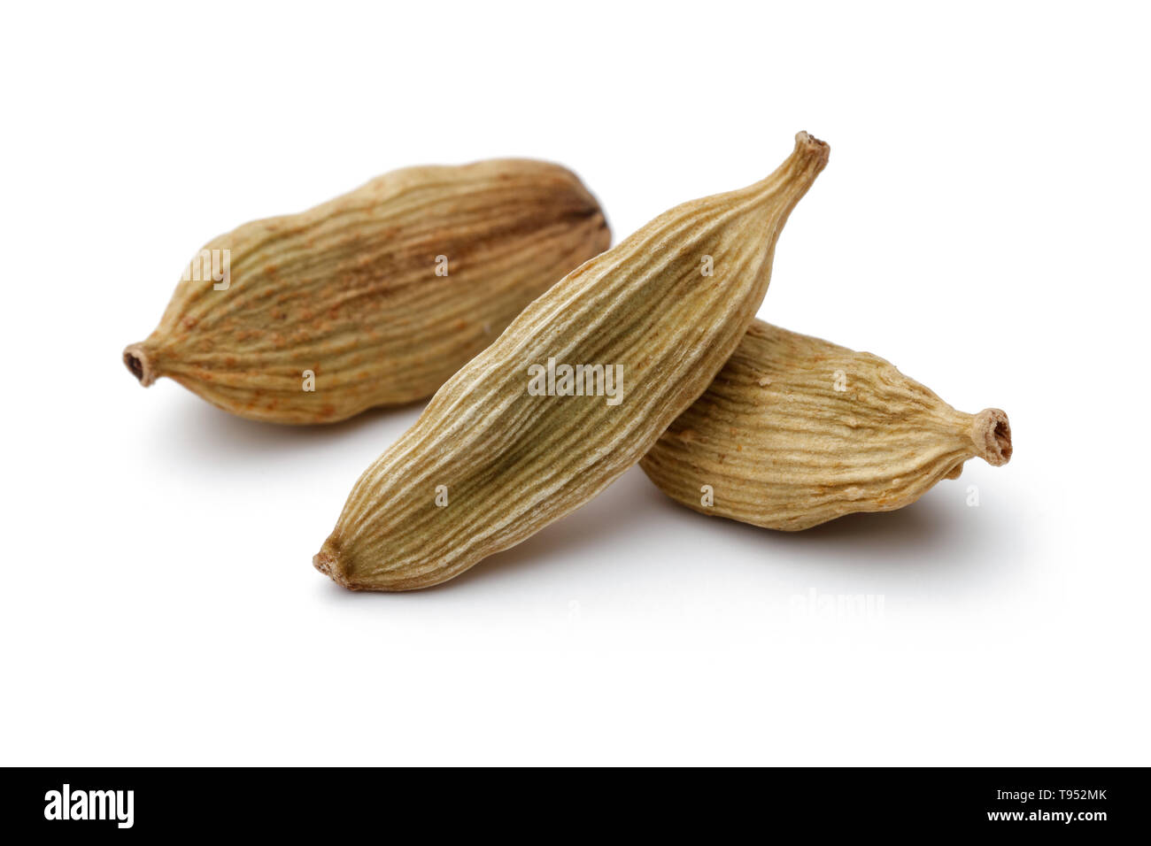 Cardamom pods isolated on white background Stock Photo - Alamy
