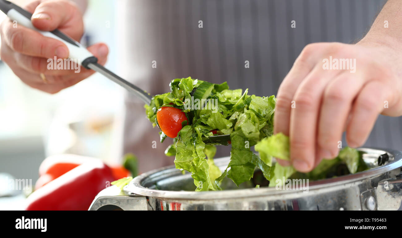 Cucumber spoon hands cooking hi-res stock photography and images - Alamy