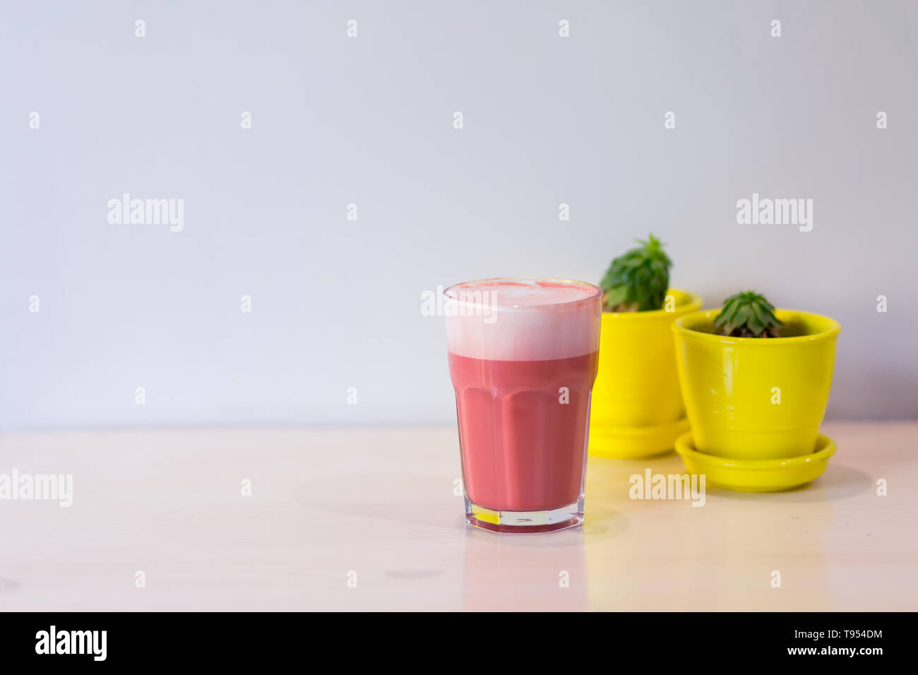 Pink, strawberry, sweet cappuccino on the white background with sticky ...