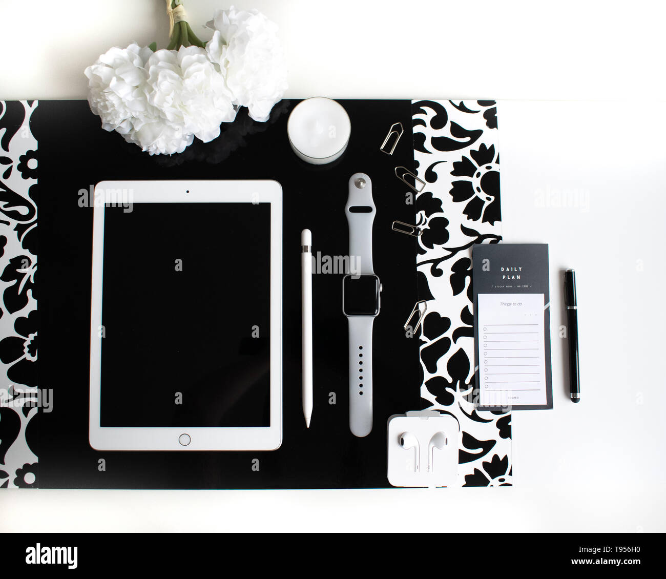flat lay: Apple products on black and white background Stock Photo - Alamy