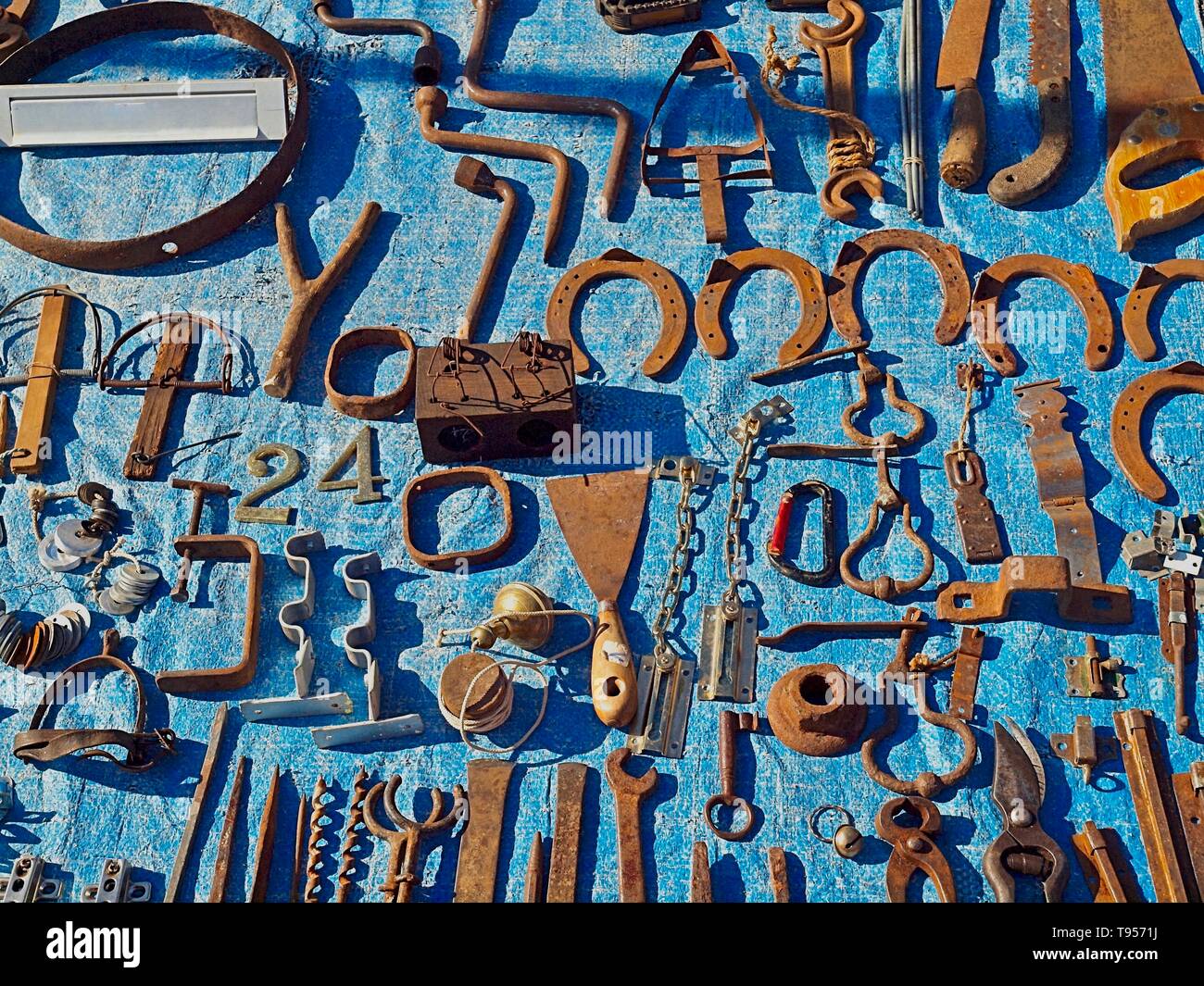 Iron tolls and horseshoes at a flea market Stock Photo - Alamy