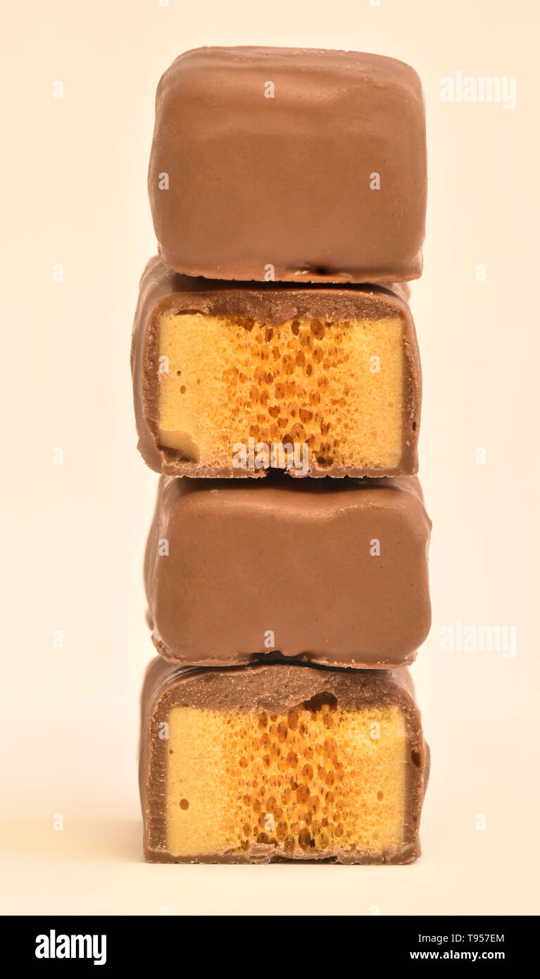 Honey comb covered in chocolate Stock Photo - Alamy