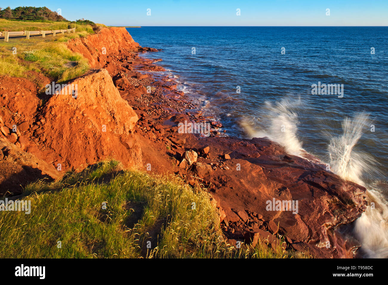 Sandy shoreline and red bluffs along the Northumberland Strait East ...