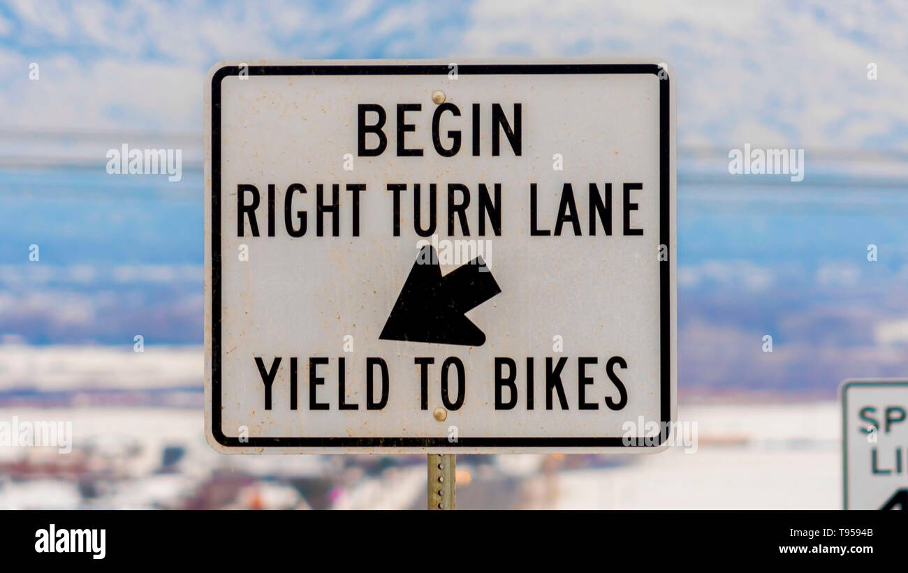 Clear Panorama Road signs with a blurry snow covered landscape and ...