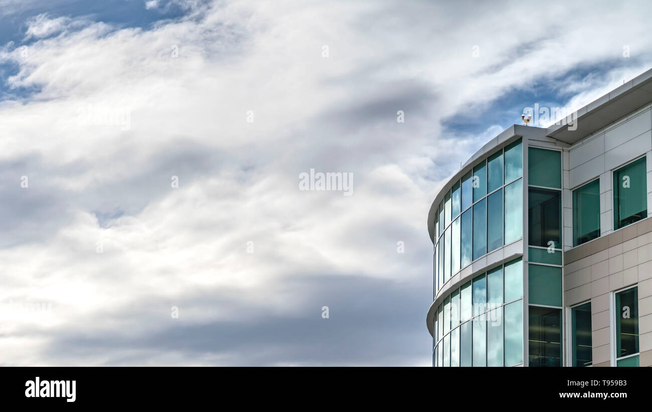 Clear Panorama Exterior of a modern building with shiny and reflective ...