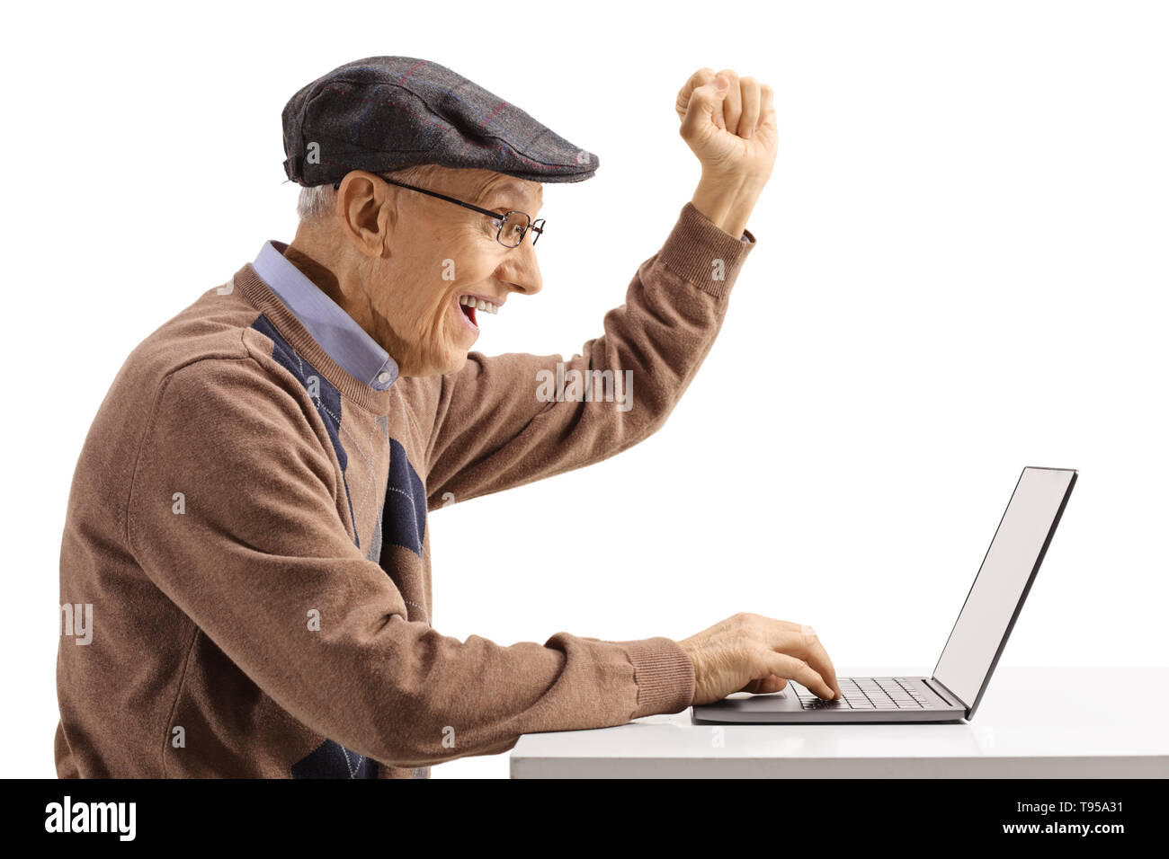 Excited Elderly Man With A Laptop Computer Gesturing Happiness Isolated