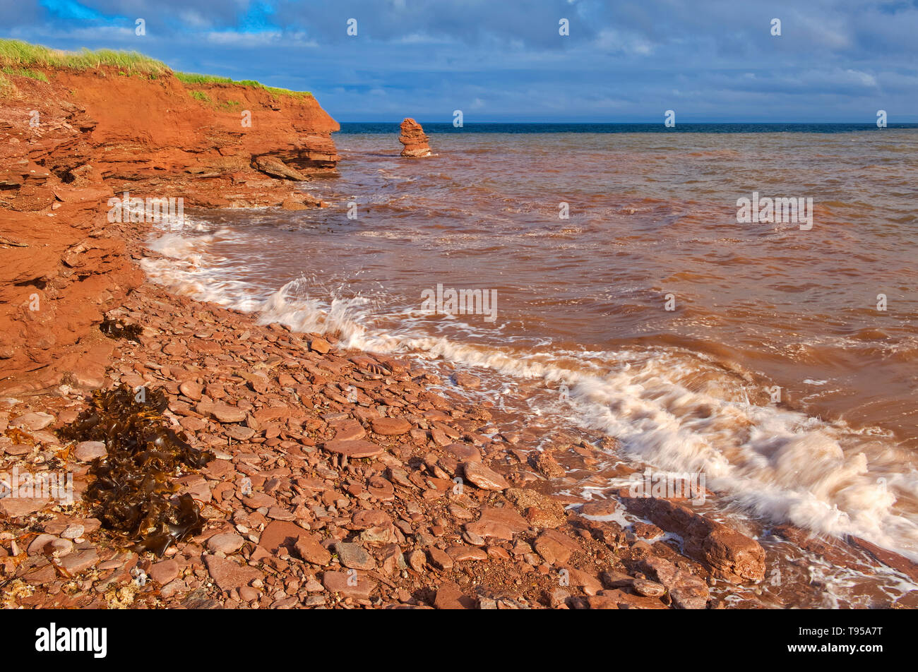 Red sandstone cliffs along the Gulf of St. Lawrence. SIte of the ...