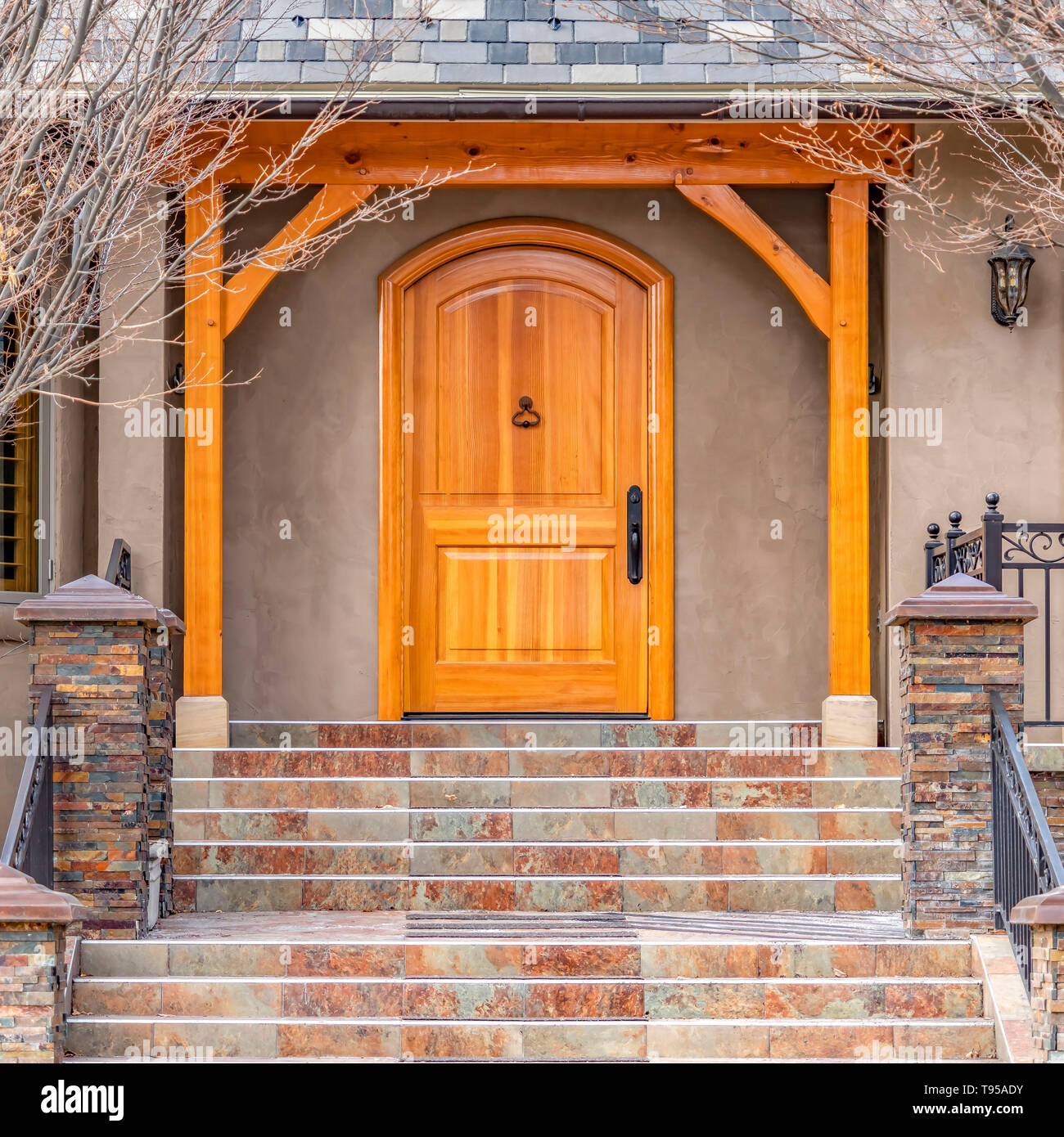 Clear Square Entryway of home framed with leafless hibernating trees on ...