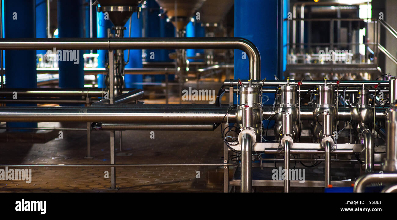 Stainless steel pipes in the factory. Construction on food production ...