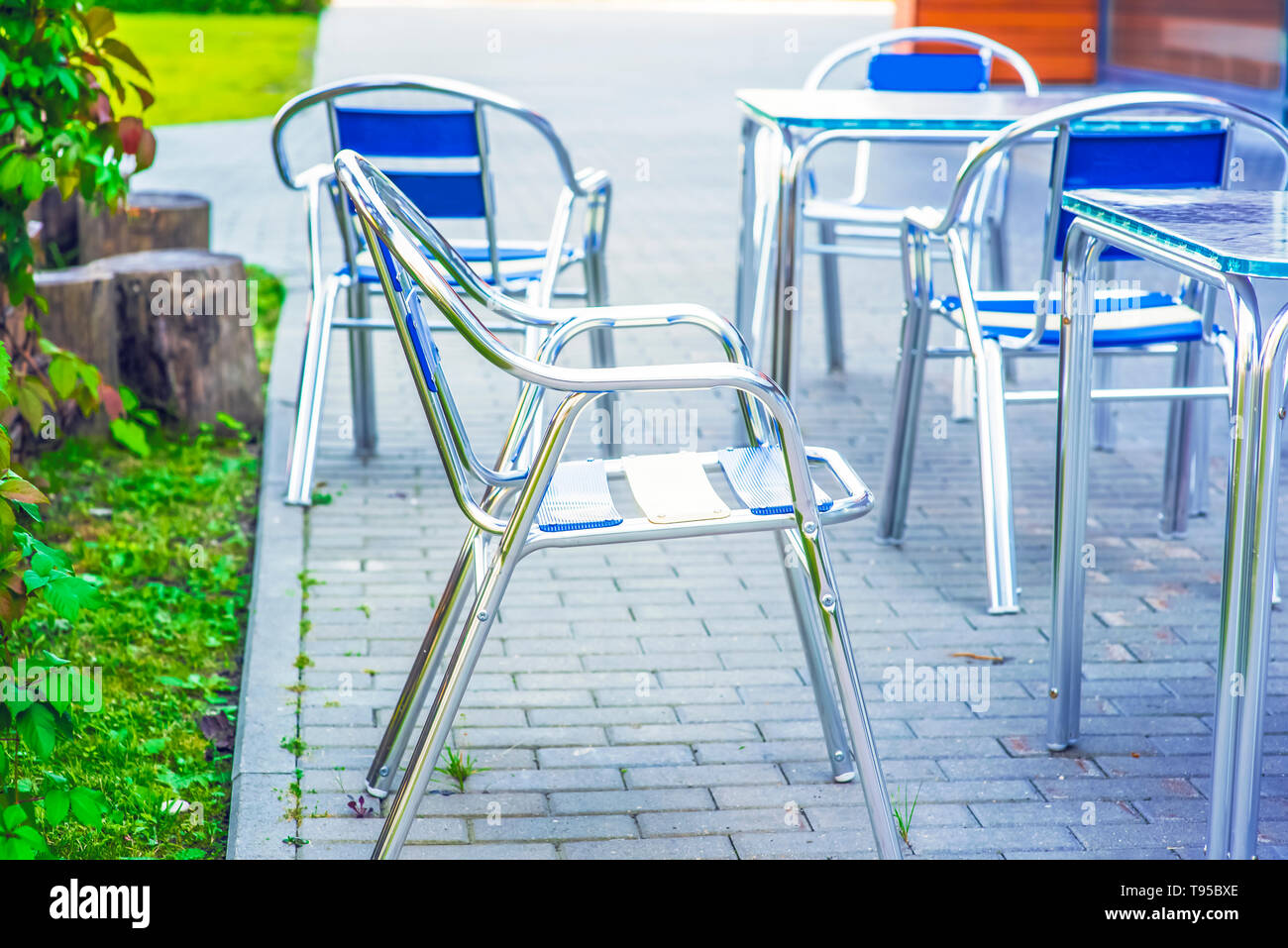 Empty chairs in outdoor cafe or restaurant on summer day Stock Photo ...