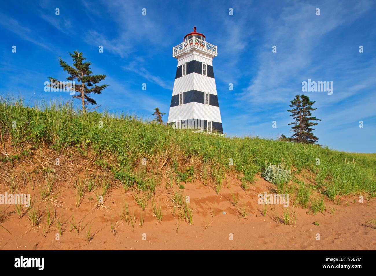 West Point Lighthouse and red sand West Point Prince Edward Island ...