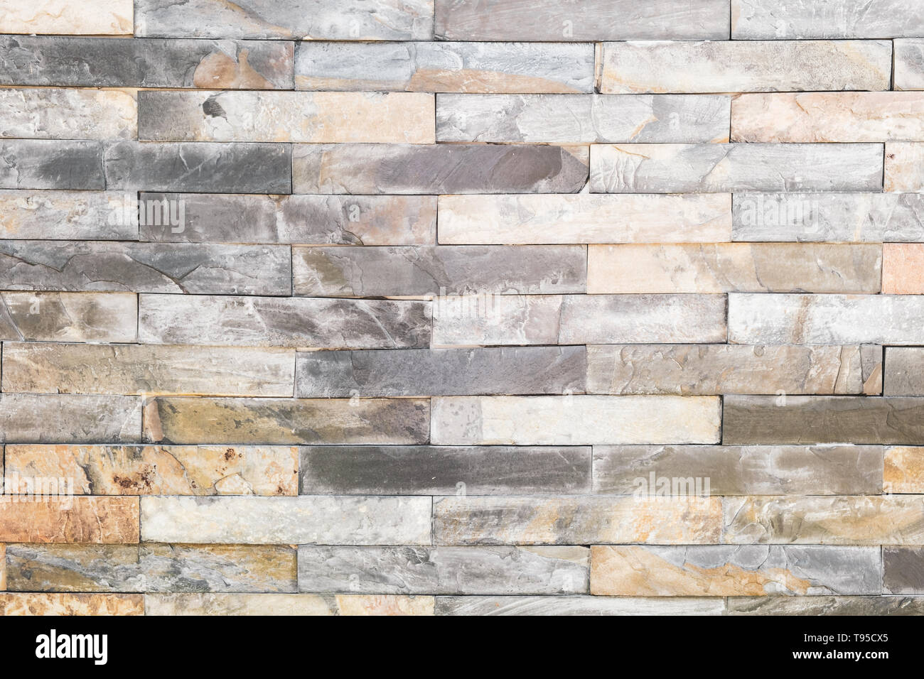 brick wall , texture of multi colored stone blocks closeup Stock Photo ...