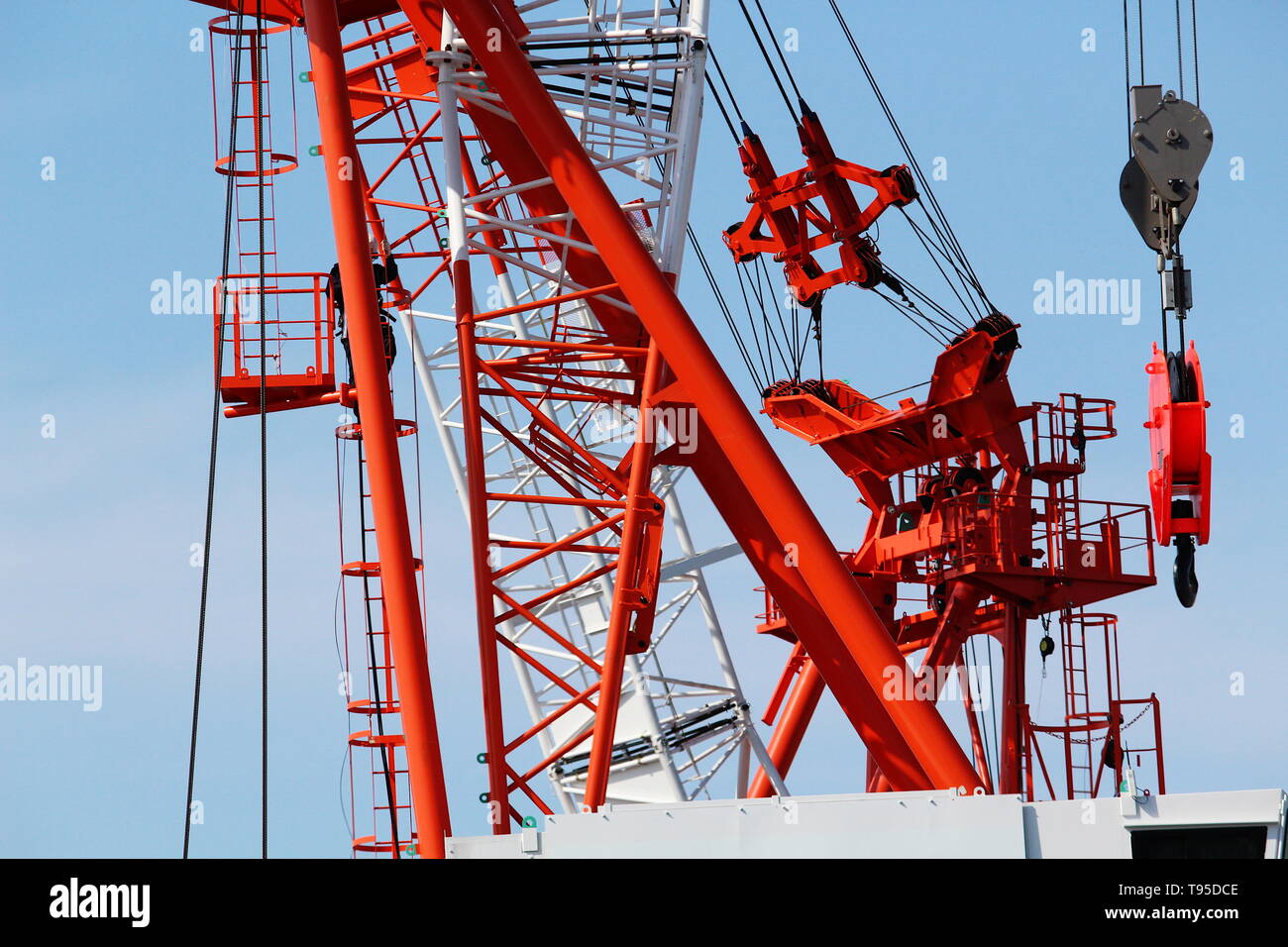 TOKYO, JAPAN - April 18, 2019: Detail of giant tower crane with worker ...