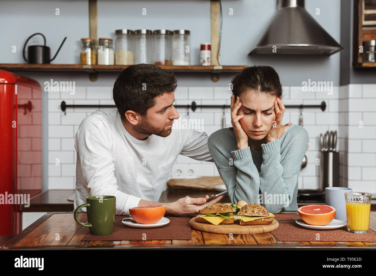 Man woman dinner table sad hi-res stock photography and images - Alamy
