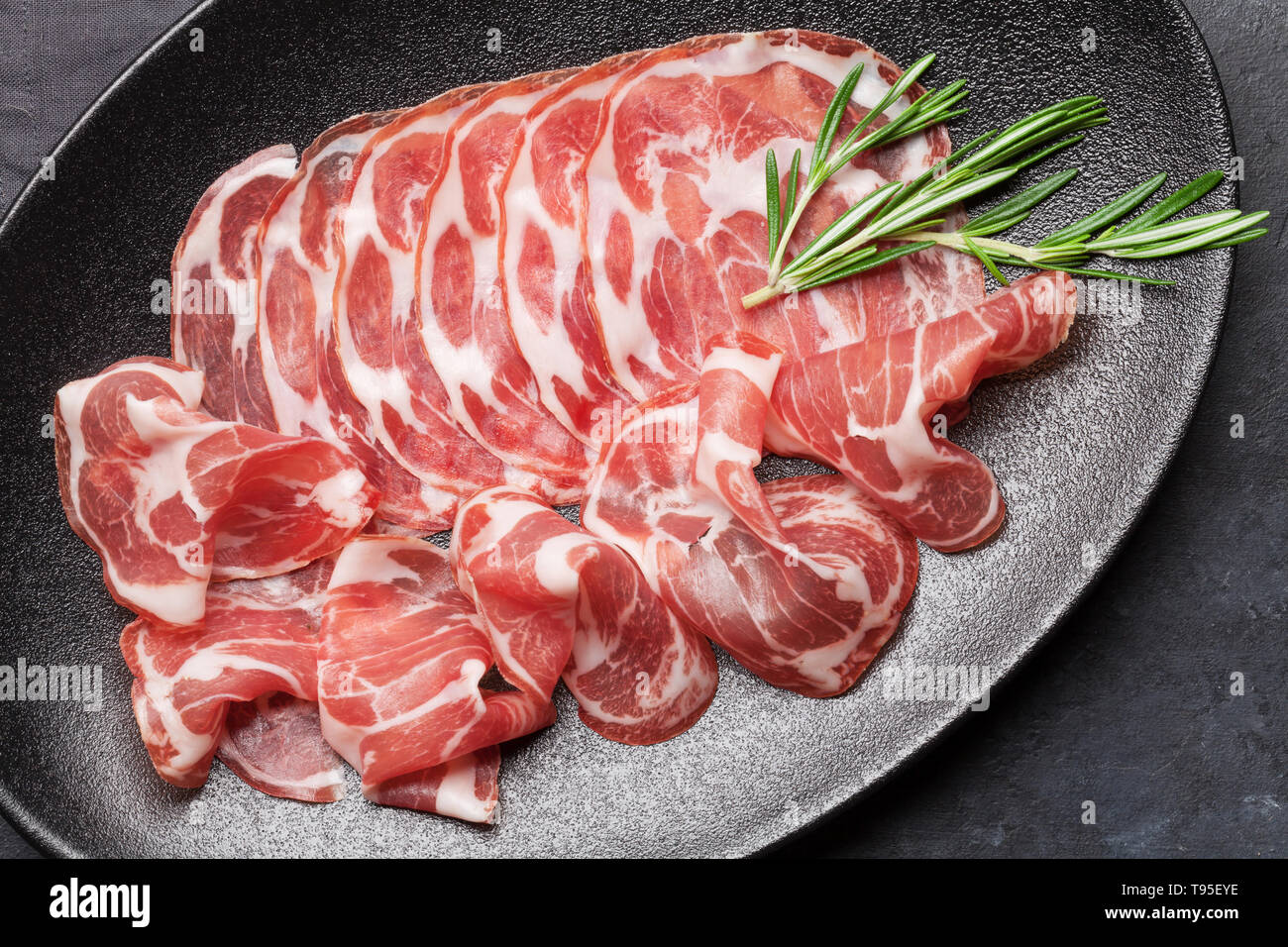 Traditional spanish jamon, prosciutto crudo, italian salami, parma ham ...