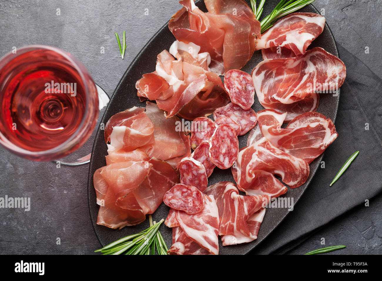 Traditional spanish jamon, prosciutto crudo, italian salami, parma ham ...
