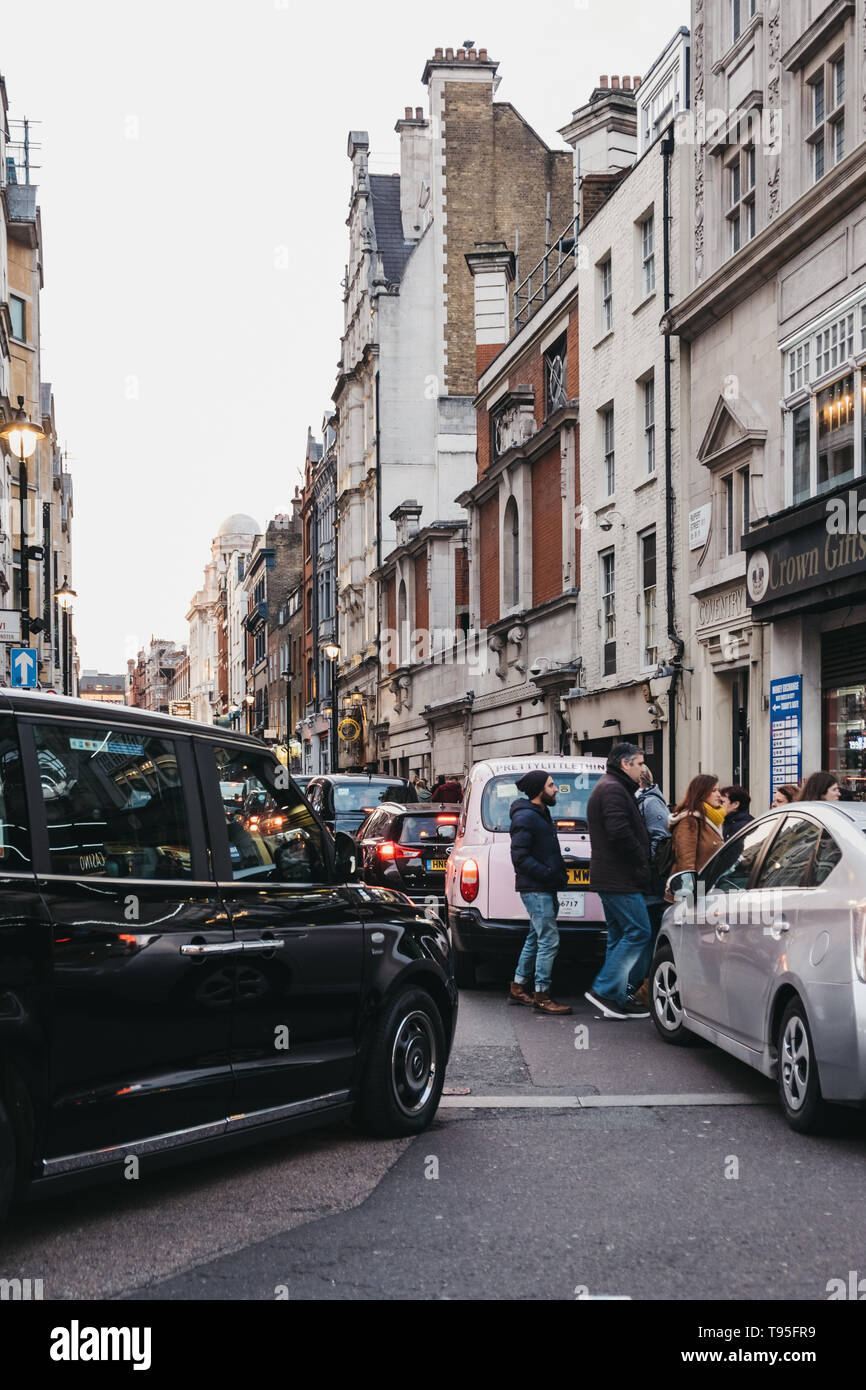 London, UK - April 14, 2019: Traffic queuing on Rupert Street, a major ...
