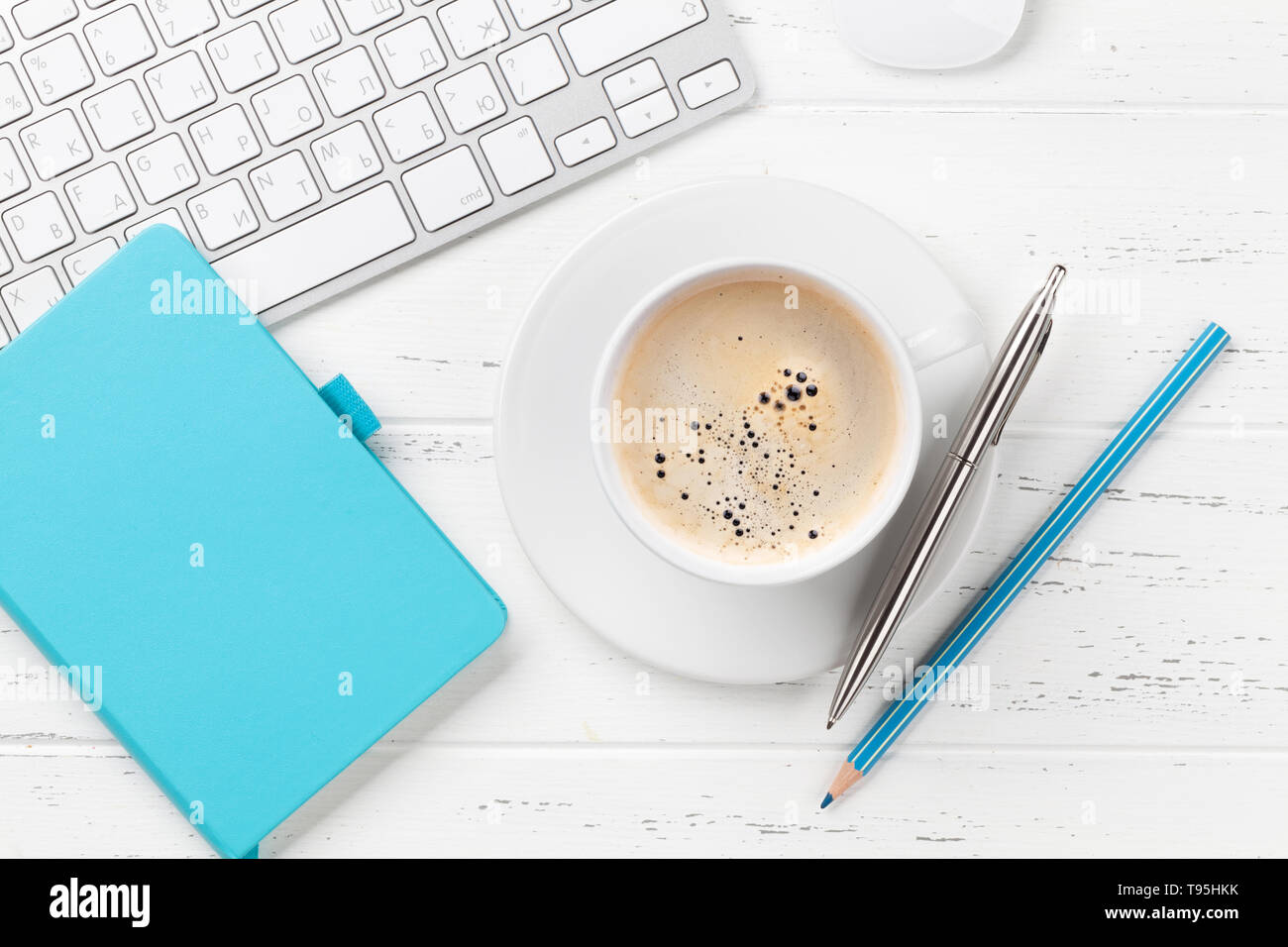 Office workplace table with coffee cup, supplies and computer. Flat lay ...