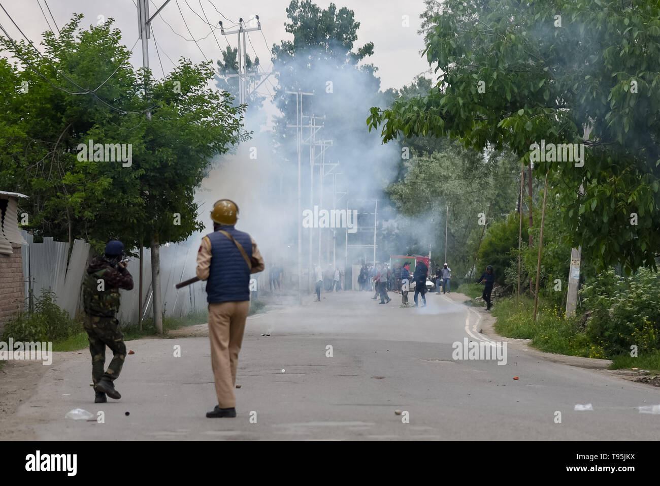 Firing tear gas smoke hi-res stock photography and images - Alamy
